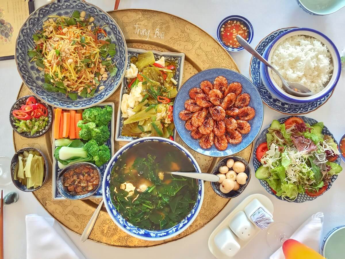 Experience Vietnamese set lunch menu on copper tray at FURAMA Resort ...